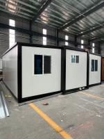 China 20ft Expandable Container House with White Cladding, Black Frame and Glass Entrance Doors for sale