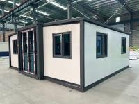 China 20ft Expandable Container House with White Cladding, Black Frame and Glass Entrance Doors for sale