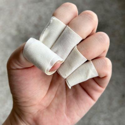 China High Viscosity Cotton Hot Melt Adhesive Tape 15mm-25mm Width Hand Tearable for sale