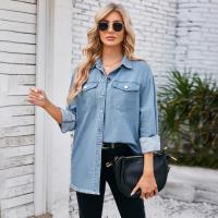 China Women's Vintage Stone-Wash Denim Shirt with Frayed Edge Details and Adjustable Cuff Buttons for sale