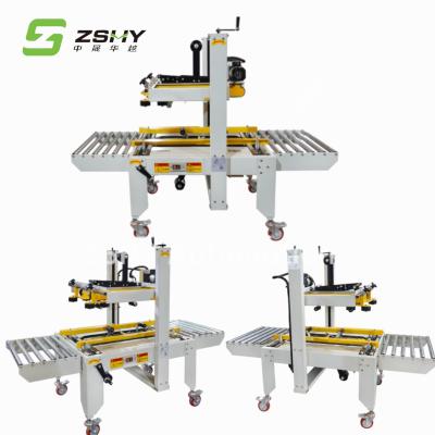 China 240W Cardboard Box Up And Down Driven Automatic Sealing Machine For Food Packing Line for sale