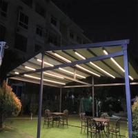 China Customized Waterproof Retractable Awning Aluminum PVC Pergola Roof Sunshade System for sale