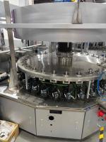 China Automatic Rotary Hot Melt Labeler for PET Glass Bottles Cans 18000-20000BPH ±1mm Accuracy for sale