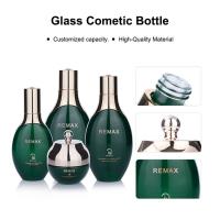 China 50ml 100ml 120ml Oval Green Glass Cosmetic Bottles Skincare Packaging Set For Skin Care for sale
