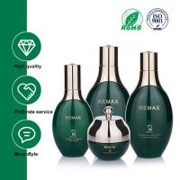 China 50ml 100ml 120ml Oval Green Glass Cosmetic Bottles Skincare Packaging Set For Skin Care for sale