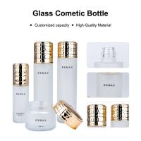 China 50g/40ml/100ml/120ml white Frosted Glass cylindrical bottle with Golden Lid for cosmetic packaging bottle for sale