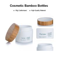 China 100ml White Cosmetic Bamboo Bottle Plastic Cream Jar With Bamboo Lid for sale