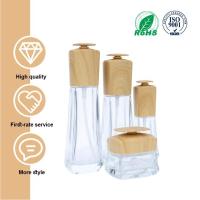 China Transparent Glass Cosmetic Bamboo Bottle Bamboo Cosmetic Jar Set With Bamboo Lids for sale