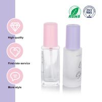 China 30ml Transparent Empty Foundation Bottle With Pink Or Purple Plastic Caps for sale