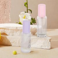 China 30ml Transparent Empty Foundation Bottle With Pink Or Purple Plastic Caps for sale