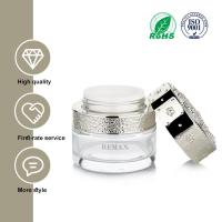 China 35g Cylinder Glass Container Transparent Glass Round Cream Jar With Gold Embossed Lid for sale