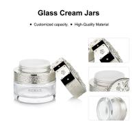 China 35g Cylinder Glass Container Transparent Glass Round Cream Jar With Gold Embossed Lid for sale