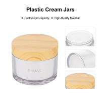 China 100g Cylindrical Transparent Clear Plastic Bottle With Bamboo Lid For Empty Cream Jar for sale