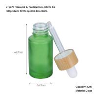 China 30ml Frosted Green Glass Dropper Bottles Essential Oil Bottle With Bamboo Dropper for sale