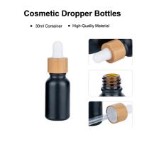 China 50ml Black Cylindrical frosted Glass Bottle With bamboo Drop For Empty Dropper Bottle for sale