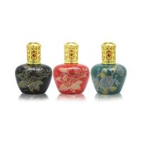 China Luxury 100ml Glass Packing Red Green Traditional Pattern Round Catalytic Aromatherapy Lamp for sale