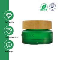 China 50g oval shape Green frosted Glass Bottle With bamboo Lid For Empty Cream Jar for sale
