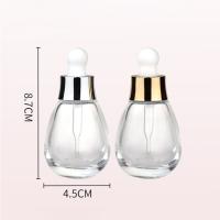 China Functional Cosmetic Dropper Bottles 30ml Thick Glass Bottle with Gold Dropper for sale