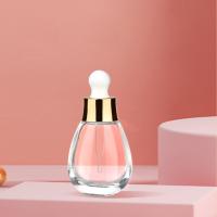 China Functional Cosmetic Dropper Bottles 30ml Thick Glass Bottle with Gold Dropper for sale