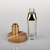 China Sophisticated Essential Oil Bottles with Luxurious Gold Press Dropper 30ml 40ml 50ml for sale