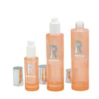 China Cosmetics Packaging Silver-plated Large Cap Pink Transparent Glass Lotion Bottle Dropper Bottle Cream Jar Set for sale