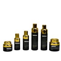 China 30ml 50ml 100ml 120ml Black Color Gold Plated Bottle Packaging With Threaded Lid Luxury Style for sale