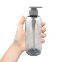 China Thick Walled 500ml Gray Transparent PET Material Flat Press Pump Plastic Bottle For Shower Gel for sale