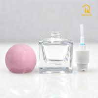 China 30ml Clear Square Glass Bottle for Lotion and Serum with Round Lid for sale