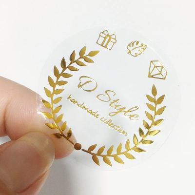 China Self Adhesive Customized Printing Clear Gold Foil Stickers Transparent Logo Label for sale