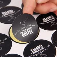 China Luxury Gold Foil Stamp Stickers Black Round Custom Printing Logo Stickers for sale
