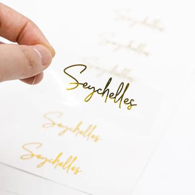 China Clear Gold Foil Waterproof Plastic Stickers Self Adhesive Vinyl Transparent Logo Label for sale