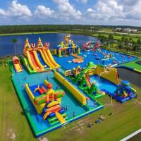 China Land Inflatable Water Park With Big Slides And Floating Toys for sale