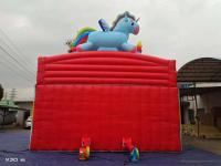 China Rainbow Horse Two Parallel Channels Inflatable Slides With Candy Shaped Pillars for sale