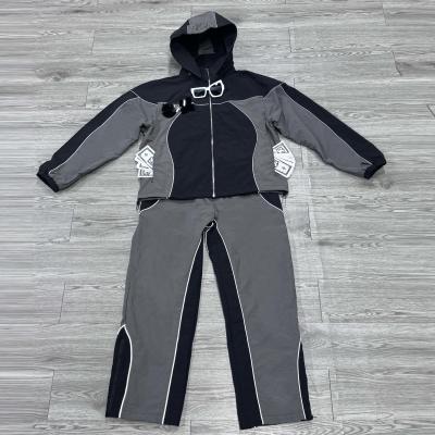 China Manufacturer Custom Men's Nylon Patchwork Sweatsuit Windbreaker Zip up Jacket and Pants Sets Reflective Streetwear Tracksuit for sale