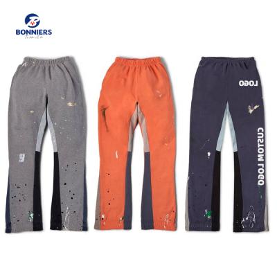 China Custom High Quality Men Jogger Sweat Pants Pant Flare Sweatpants Splatters Elastic Patchwork Graffiti Paint  Men Flare Pants for sale