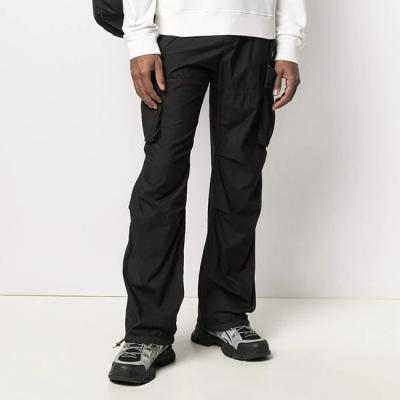 China Fashion Design Flared Pants Custom Logo Loose Cargo Trousers Drawstring Pockets Street Nylon Pants for sale
