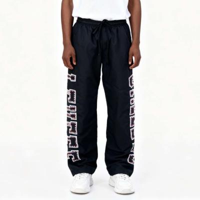 China Windbreaker Nylon Oversized Polyester Rhinestone Printed Mens Sweatpants Custom Baggy Jogger Track Flare Sweat Pants Unisex for sale