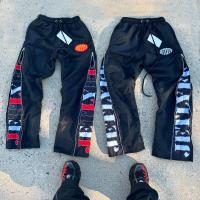 China Custom Zipper Letter Print Track Nylon Pants for Men Wholesale Polyester Casual Windbreaker Waterproof Streetwear Flair Pants for sale