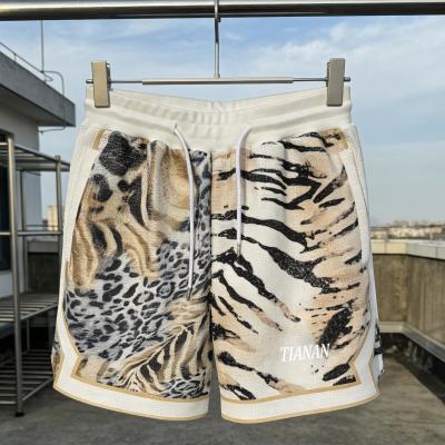 China Hot Selling Custom Men's Basketball Shorts All Over Print Leopard Colorblock Sublimated Mesh Breathable 5 Inch Inseam Shorts for sale