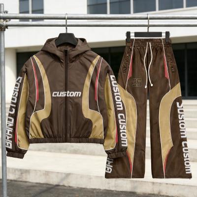 China Manufacturers Custom Fashion Streetwear Waterproof Windbreaker Sweatsuit Lightweight Tracksuit Printed Nylon Jogger Outfit Sets for sale