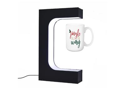 China Can Bottle Magnetic Levitation Display Stand Makeup Cosmetics Perfume Bottle Disp for sale