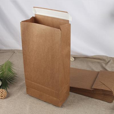 China Brown Flat Bottom Kraft Paper Mailing Bags 20x30cm Reinforced Base & Handles for sale
