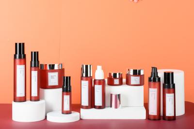 China Empty Cosmetic Packaging Set Red Frosted PET Face Cream Jar 15ml-300ml and Serum Bottle 20ml-1000ml for sale