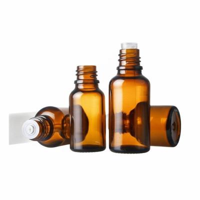 China 30ml Amber Glass Cosmetic Bottle Round Screw Cap for Essential Oils Perfumes for sale