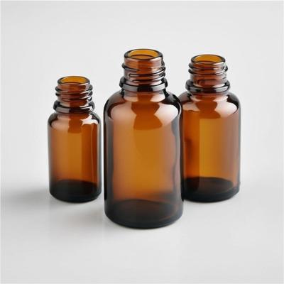 China Round Amber Cosmetic Bottles 10ml 100ml Screw Cap for Skincare Essential Oils Perfumes for sale