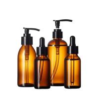 China Amber Cosmetic Bottles 10ml 30ml 50ml Screw Cap Round Glass for Skincare Essential Oils for sale