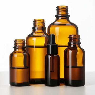 China Round Amber Cosmetic Bottles 10ml 30ml 50ml with Screw Cap for Serums Essential Oils Skincare Packaging for sale