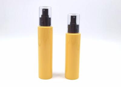 China Bright Yellow PET Cosmetic Bottles 120ml 150ml with Black Sprayer and Transparent Cup for sale