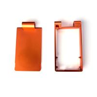 China CNC Machined 6061-T6 Aluminum Foldable Phone Stand Housing Orange Anodized Magnetic Wireless Charger Enclosure for sale