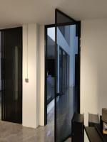 China Black Varnished Finish Aluminum Courtyard Gates Exterior House Modern Revolution Door for sale